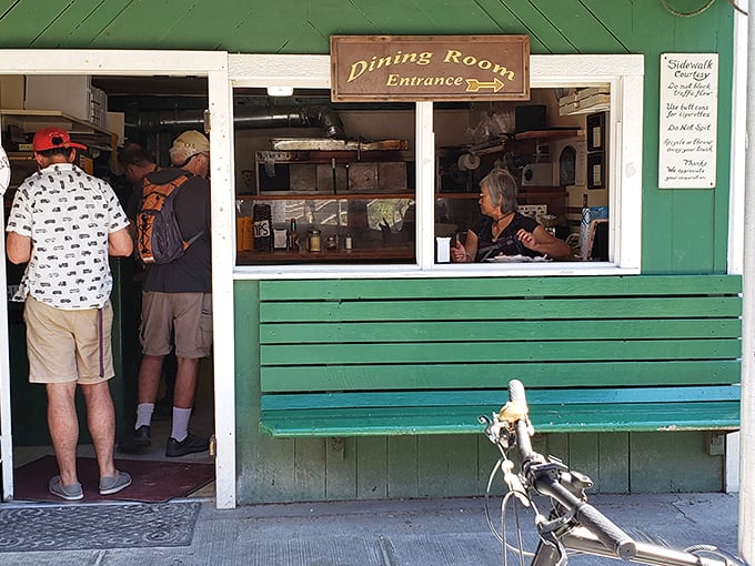 The 'Dining Room Entrance' sign might be the most optimistic understatement in Washington. Worth every cramped bite.