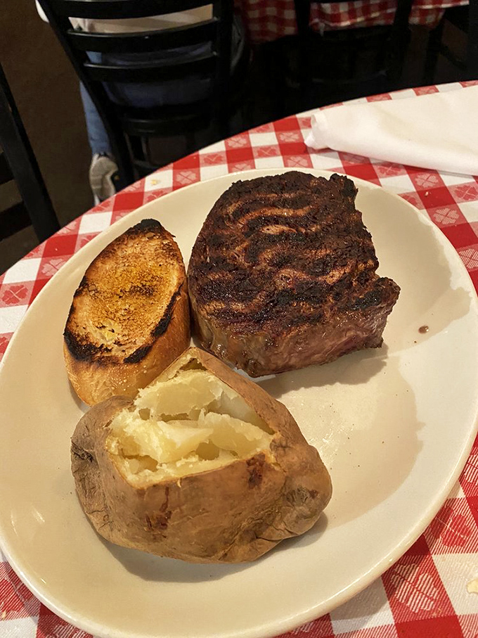The kind of steak that makes conversation stop mid-sentence. Notice the respectful silence at surrounding tables.