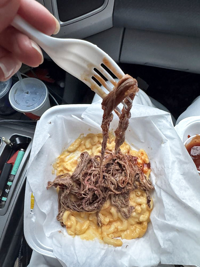 Mac and cheese topped with pulled brisket, eaten in a car. When barbecue's this good, waiting until you get home becomes physically impossible.