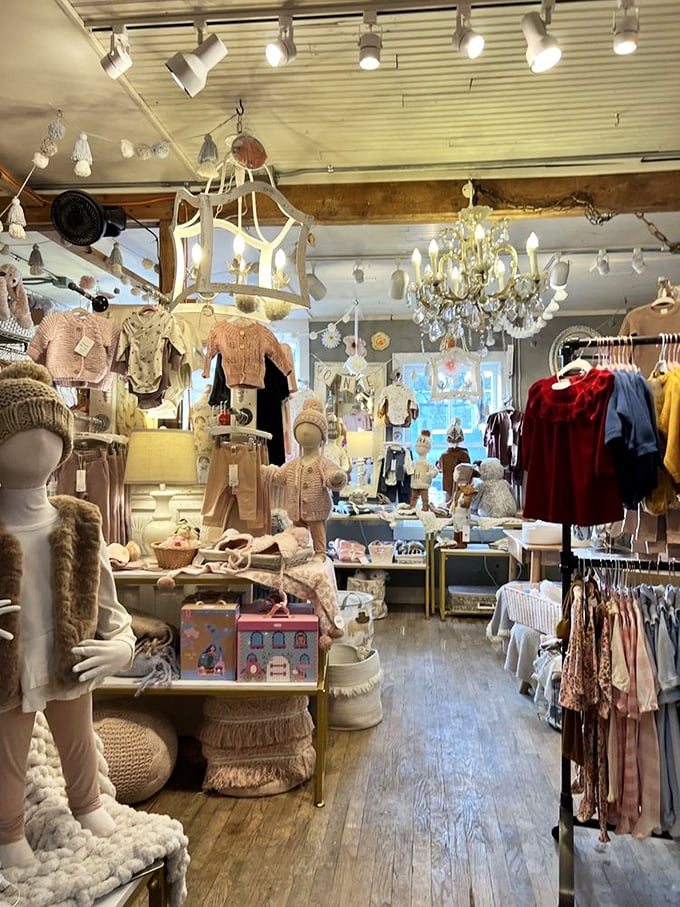 A chandelier hangs above children's clothing displayed with more charm than a boutique on Rodeo Drive.