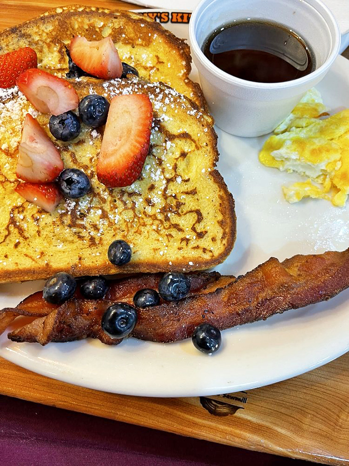 French toast that's dressed for success with berries, bacon, and enough maple syrup to make a Canadian weep with joy.