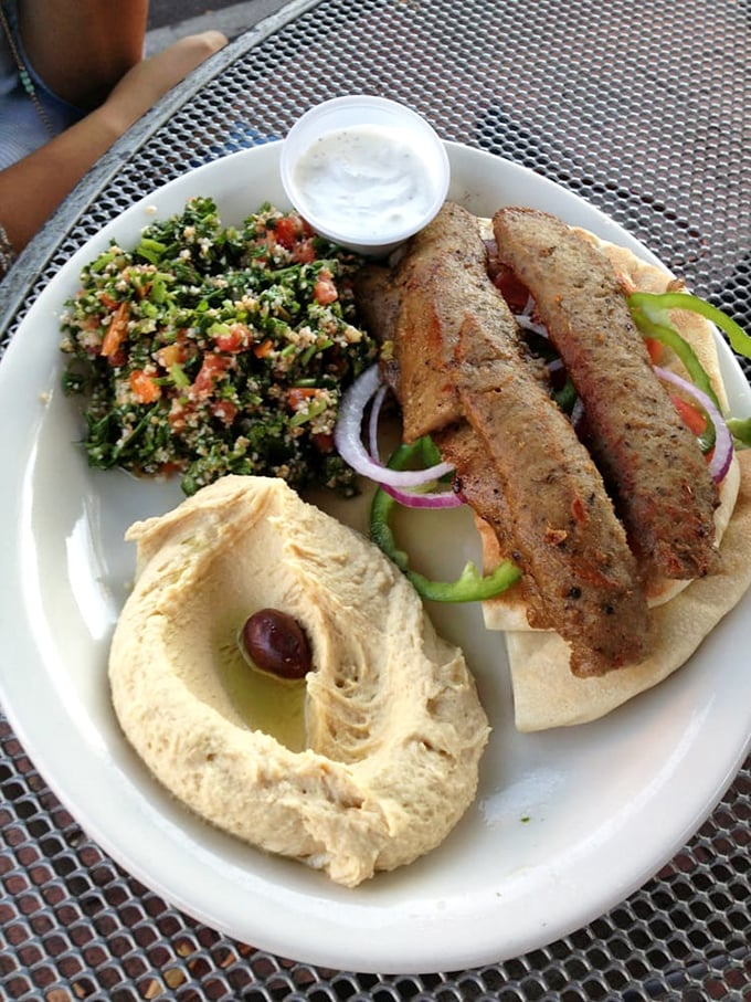 A perfect marriage of flavors&mdash;kebabs with tabbouleh and hummus. This plate doesn't need a dating app; it's already found its soulmates.