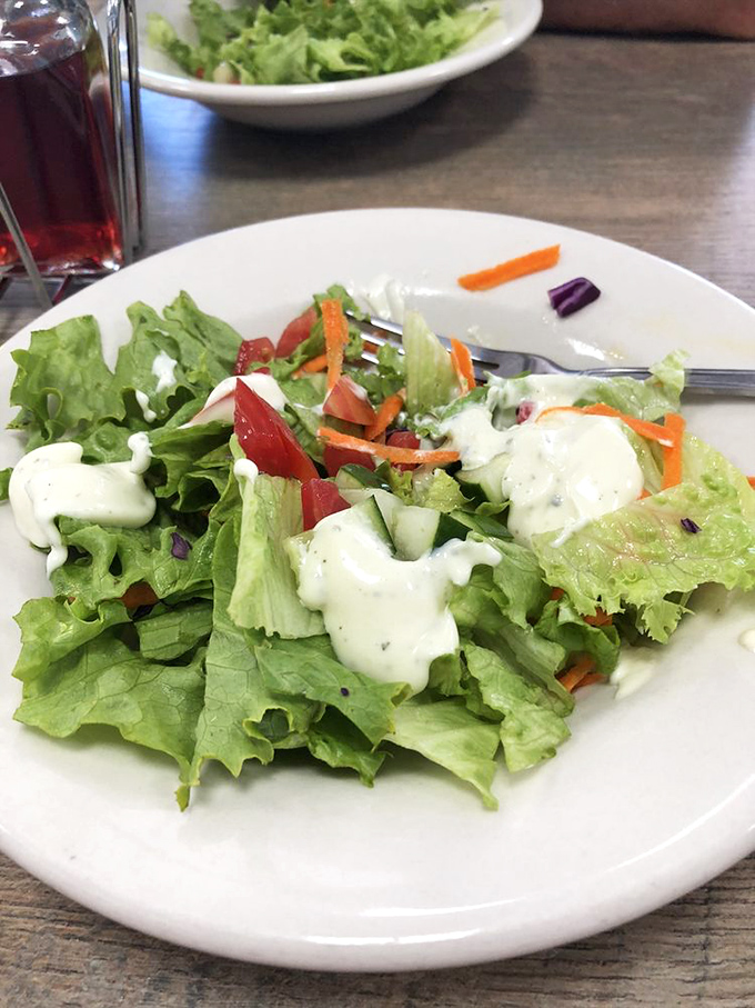A house salad that proves vegetables can be more than an obligation&mdash;fresh, colorful, and dressed just right for those "maybe I should eat something green" moments.
