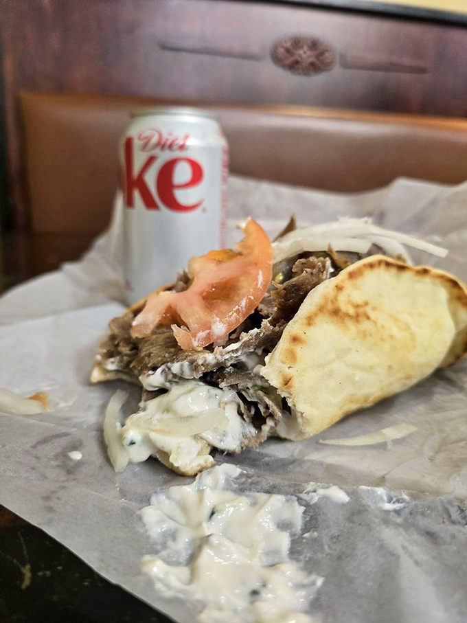 This partially devoured gyro beside a Diet Coke is the working person's power lunch. Who needs expense accounts when you have this?
