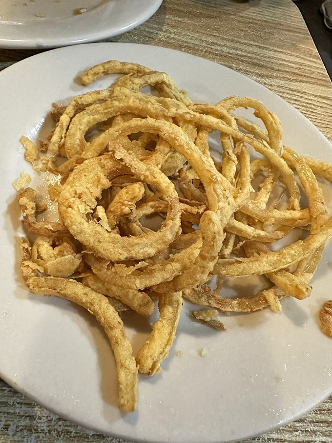 Onion rings that deserve their own fan club. Crispy, golden hoops that make the perfect supporting cast for the star of the show.