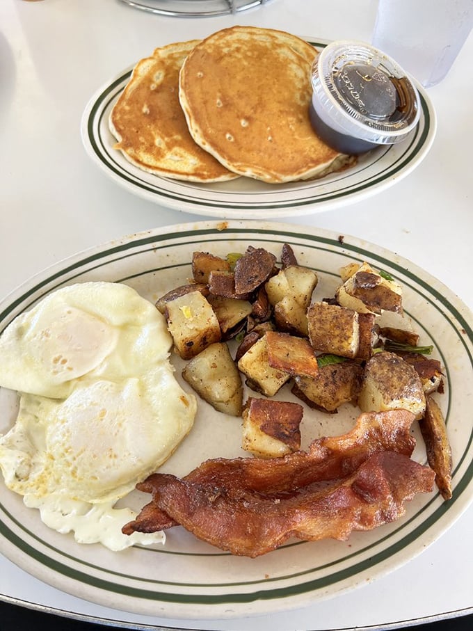 These aren't just pancakes—they're golden discs of happiness waiting for their maple baptism. Childhood in circular form.