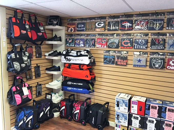 The pro shop wall displays team loyalties alongside serious bowling gear&mdash;where weekend warriors transform into lane legends with the right equipment.