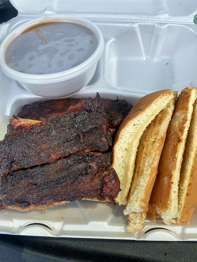 These ribs have that mahogany bark that barbecue dreams are made of, with Texas toast standing by for sauce-sopping duty.