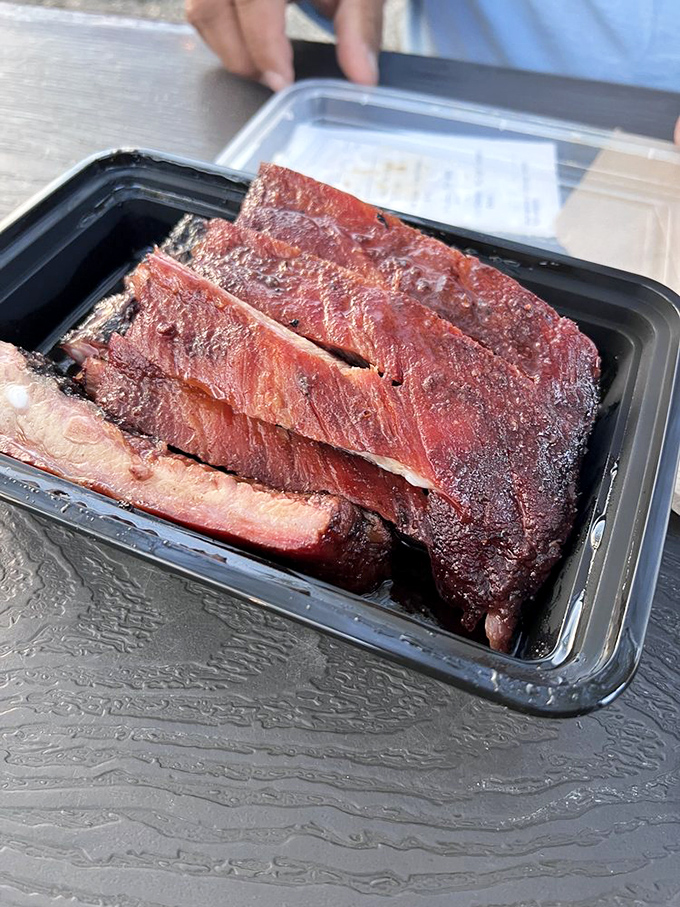 These ribs have that textbook smoke ring &ndash; the pink halo that separates backyard dabblers from true pitmasters.