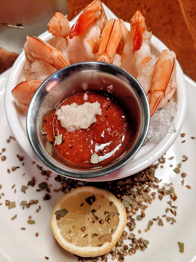 Shrimp cocktail elevated beyond poolside nostalgia. These Gulf beauties stand at attention around their spicy sauce companion.