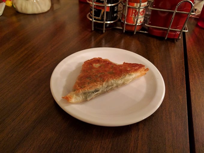 Spanakopita that shatters with each bite, revealing a spinach-feta filling that makes you wonder why you ever ate vegetables any other way.