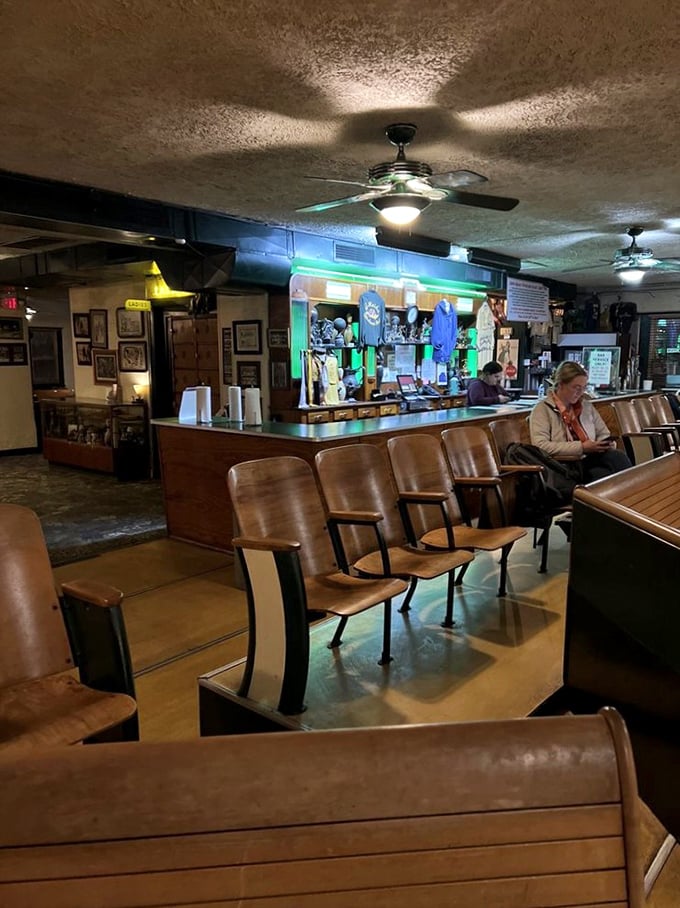 Vintage wooden seating creates the perfect viewing gallery for cheering on friends or plotting your next strategic frame.