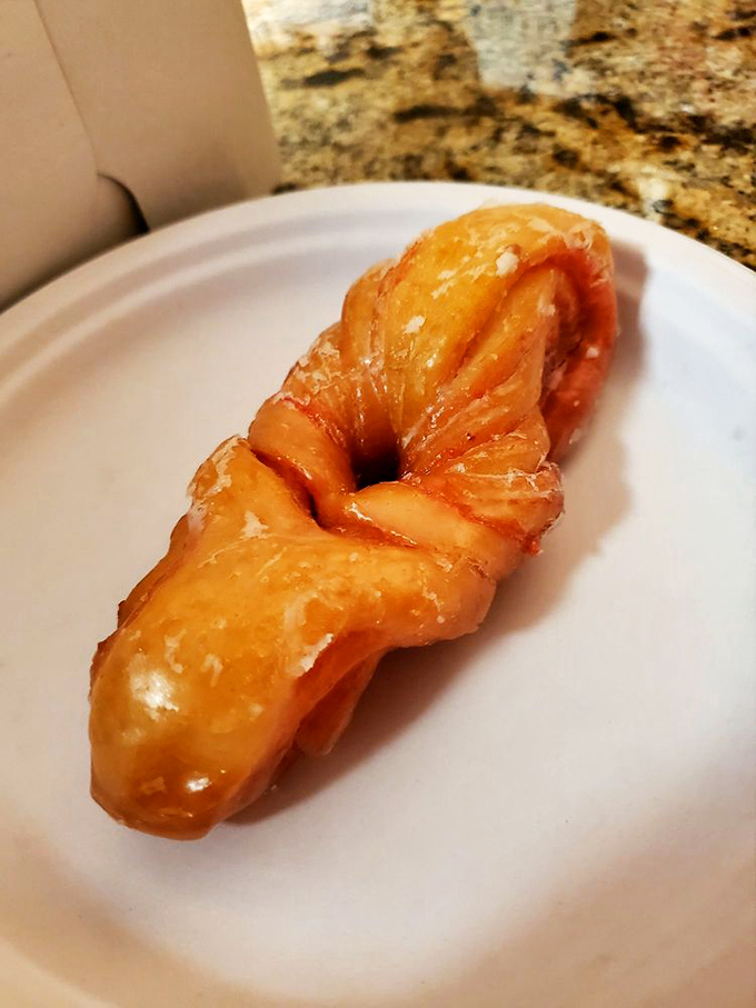 This strawberry knot isn't just a pastry; it's a sweet geometry lesson that proves deliciousness can take many twisting forms.