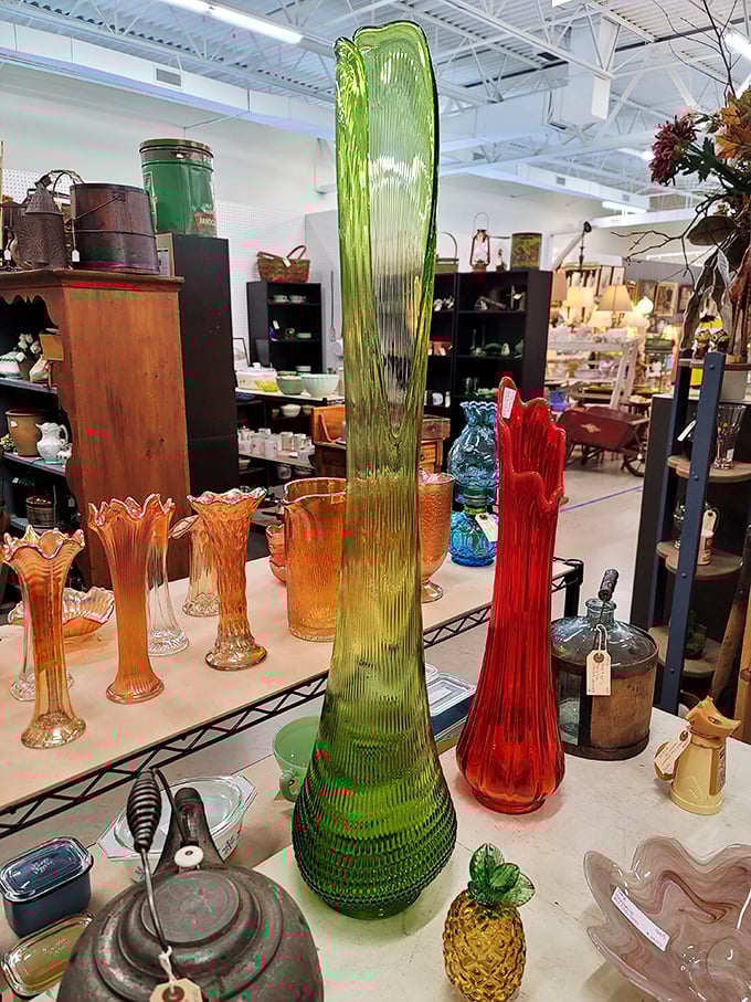 Colored glass that catches light like liquid jewels. That green swizzle-stick giant would make even the most minimalist decorator reconsider everything.