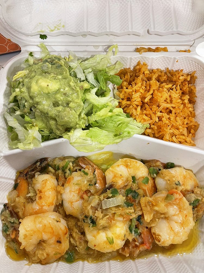 Plump camarones swimming in garlicky butter with perfectly cooked rice alongside. Seafood this good makes you forget you're miles from any coast.