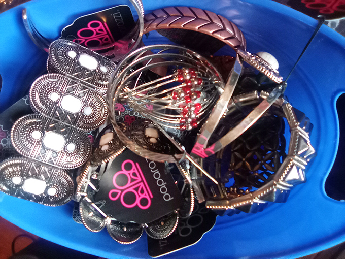 
A blue bin brimming with jewelry treasures&mdash;each piece with its own mysterious history. Dig in and discover someone else's once-beloved baubles ready for their next chapter. 