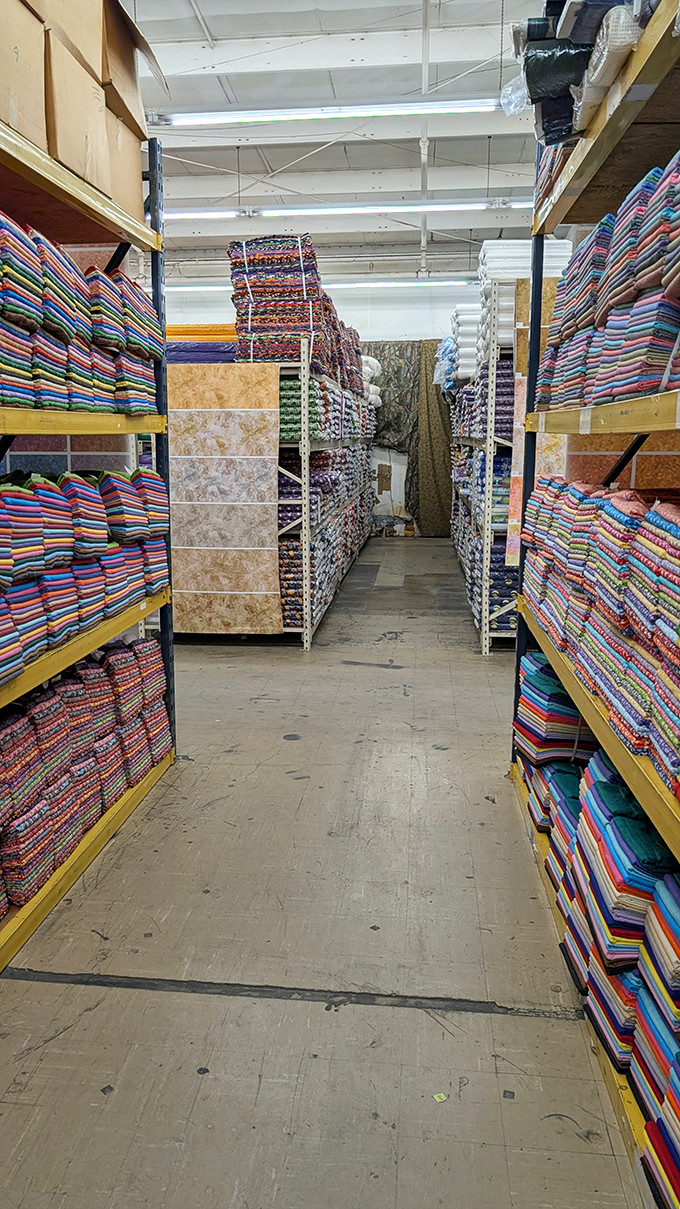 The aisles stretch on like fabric infinity. Quilters have been known to leave breadcrumb trails to find their way back.