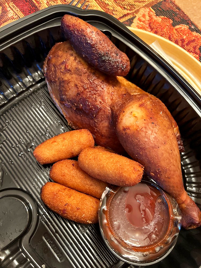 Chicken that's had a proper introduction to smoke and fire. Those hush puppies are the perfect supporting cast.
