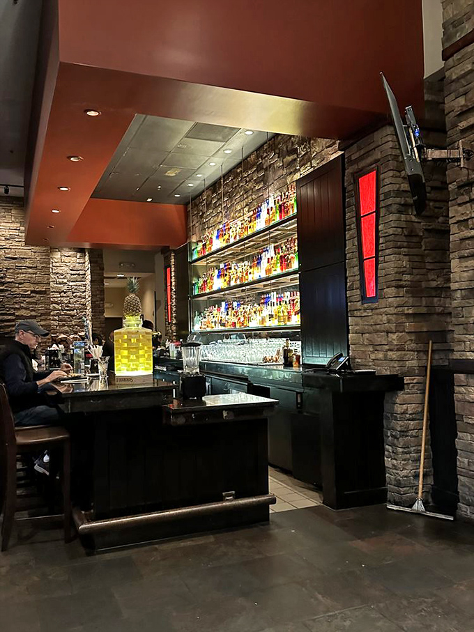 A bar that belongs in an architectural magazine, with bottles illuminated like treasures. Perfect for pretending you're in a sophisticated movie scene.