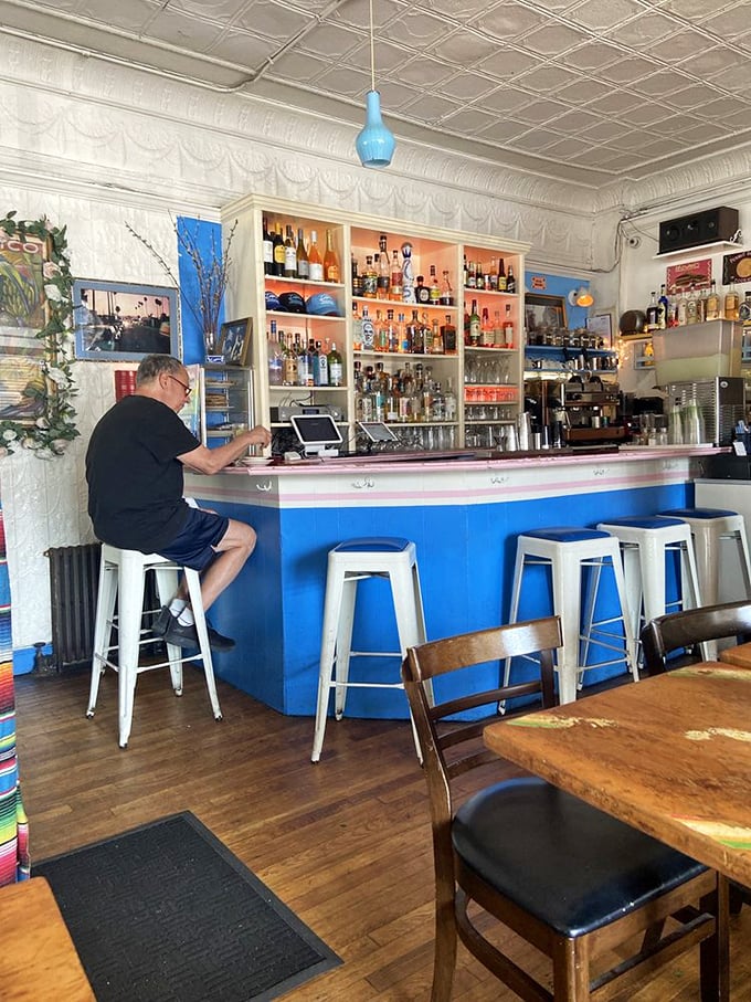 The bar's cheerful blue facade and neatly arranged spirits aren't trying to be trendy &ndash; they're just confidently serving proper margaritas while the city chases the next cocktail fad.