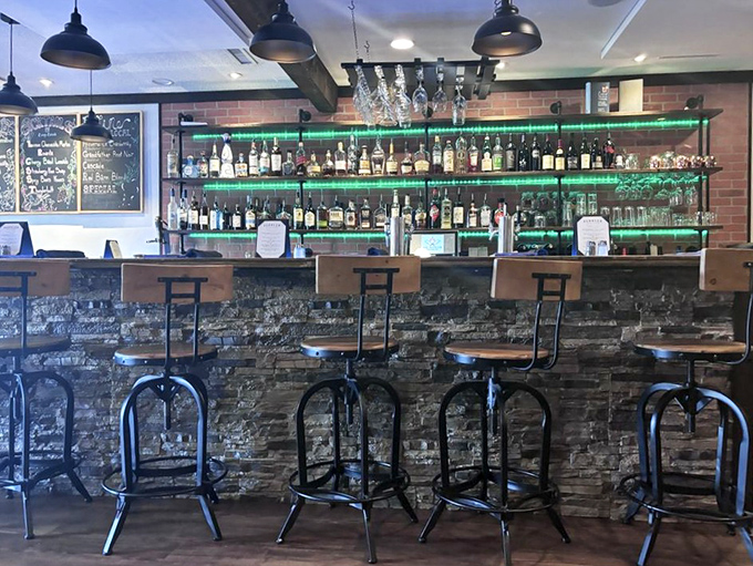 A bar where the blue lighting makes every bottle look like it contains some magical elixir, and perhaps after two drinks, it does.