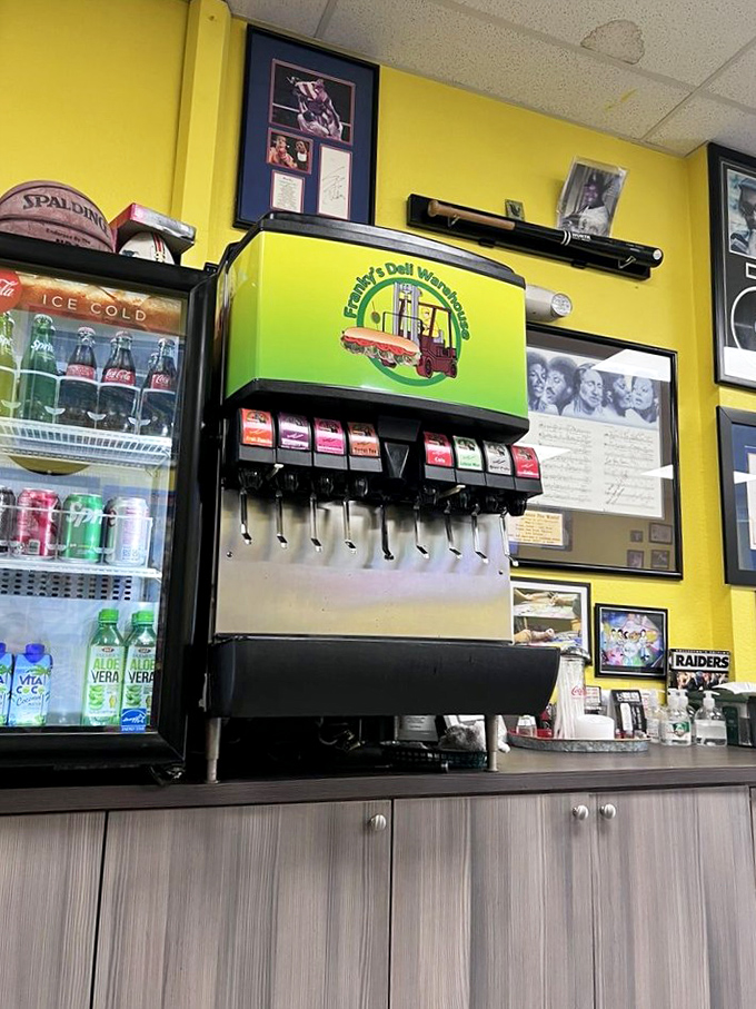The soda fountain stands ready for service beneath walls celebrating local sports heroes. Hydration station meets Miami pride.