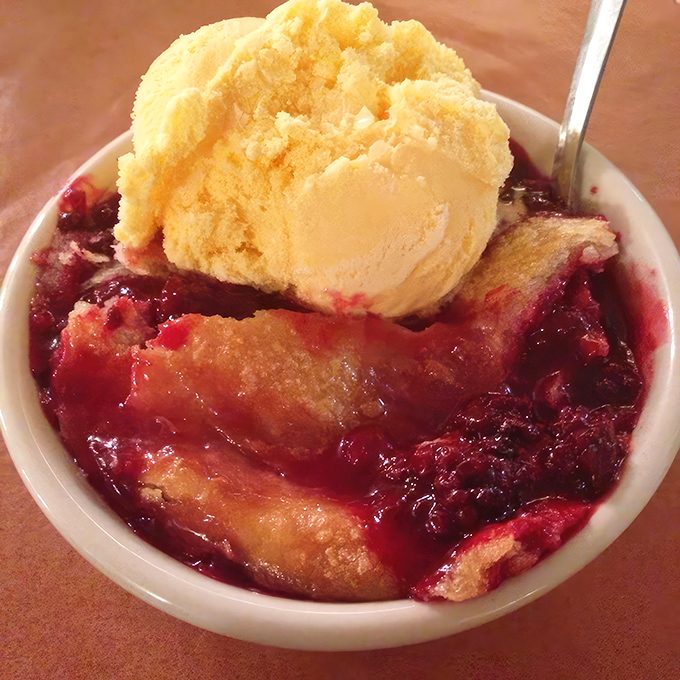 Blackberry cobbler topped with vanilla ice cream&mdash;where fruit and pastry perform a summer ballet. Worth saving room for, even when you're stuffed.