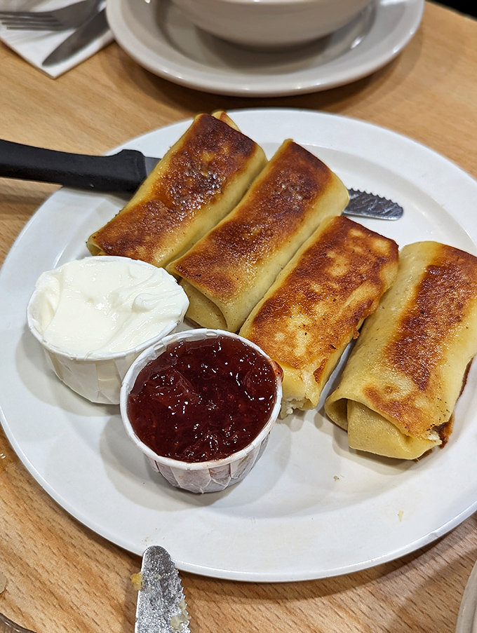 Blintzes: where pancakes and cheesecake had a delicious love child. These golden pockets of joy are like edible sunshine on a plate.
