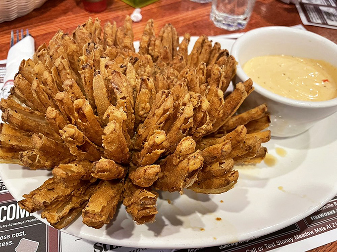 The Bloomin' Onion: nature's perfect food, if nature had access to deep fryers and seasoned batter. A crispy, golden masterpiece.