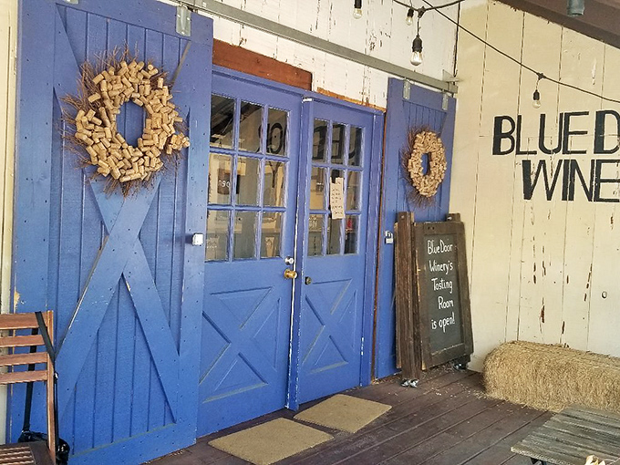 Blue Door Winery's rustic entrance, complete with cork wreaths, promises vineyard magic that pairs suspiciously well with&mdash;you guessed it&mdash;apple pie.