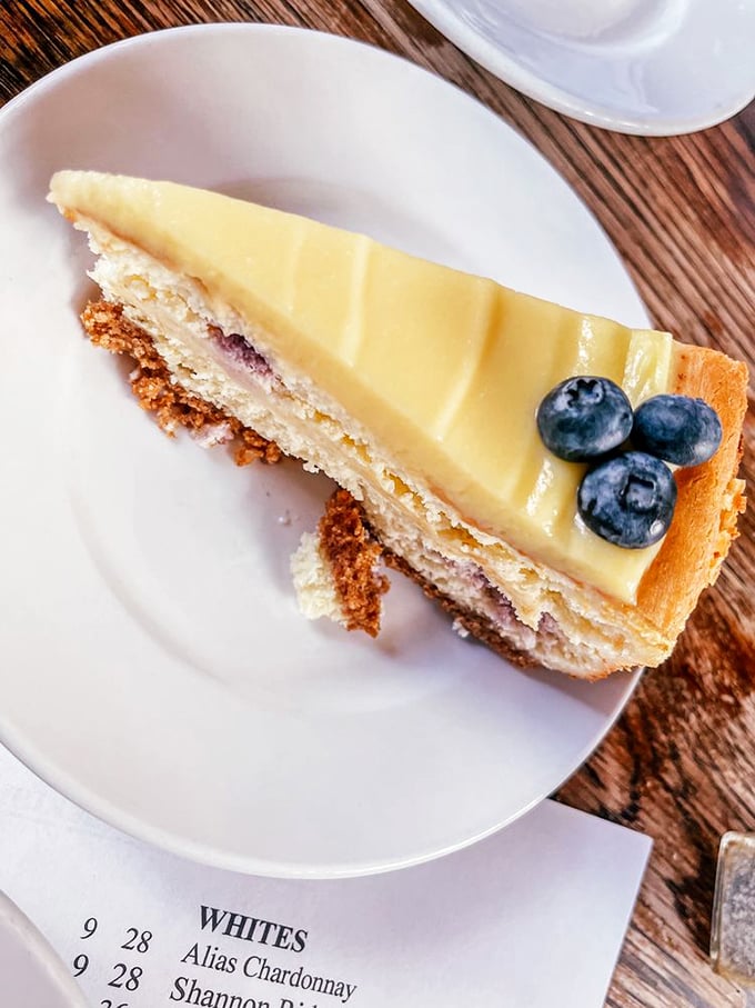 This slice of cheesecake with three perfect blueberries is what happens when dessert gets dressed up for a special occasion.