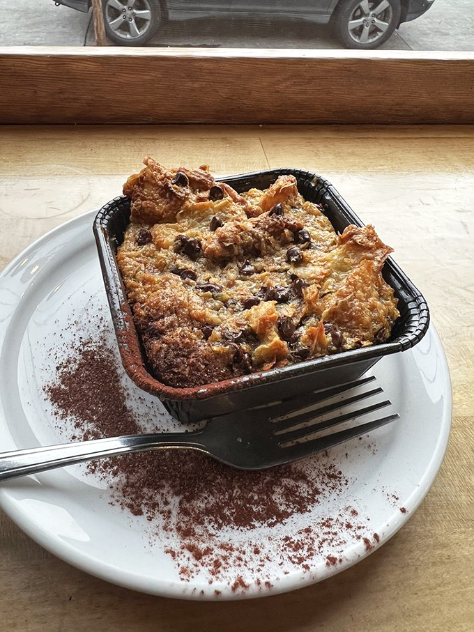 Bread pudding that makes you question why anyone bothers with lesser desserts when this warm, chocolate chip-studded glory exists.