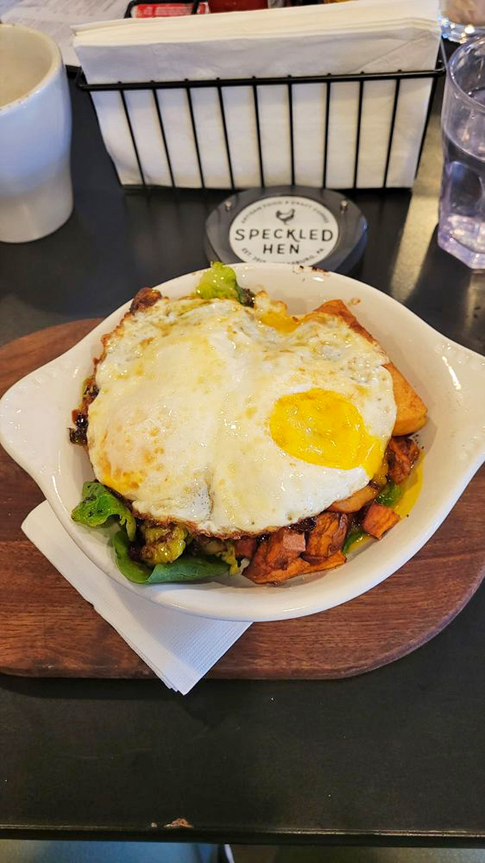 A sunny-side-up egg crowning a throne of breakfast potatoes and veggies. This bowl doesn't just feed you&mdash;it hugs you from the inside.