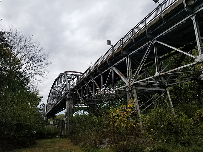Engineering meets artistry in New Harmony's historic bridge, where geometric patterns of steel stretch across the Wabash like industrial lace.