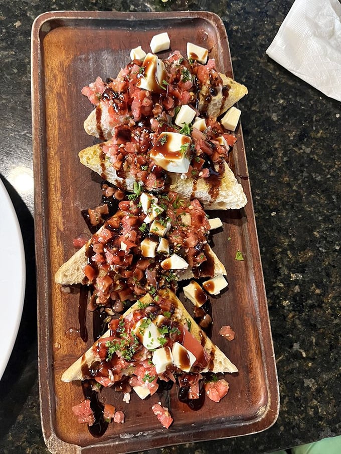 Bruschetta that doesn't whisper "I'm an appetizer" &ndash; it announces "I could be your whole meal" with fresh tomatoes and balsamic that means business.