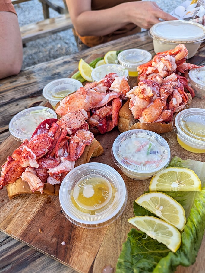 The wooden board presentation transforms lunch into an event&mdash;these rolls aren't just a meal, they're a maritime celebration.