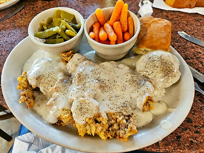 Chicken fried steak with cream gravy covering every glorious inch—the dish that's launched a thousand cholesterol medications and zero regrets.