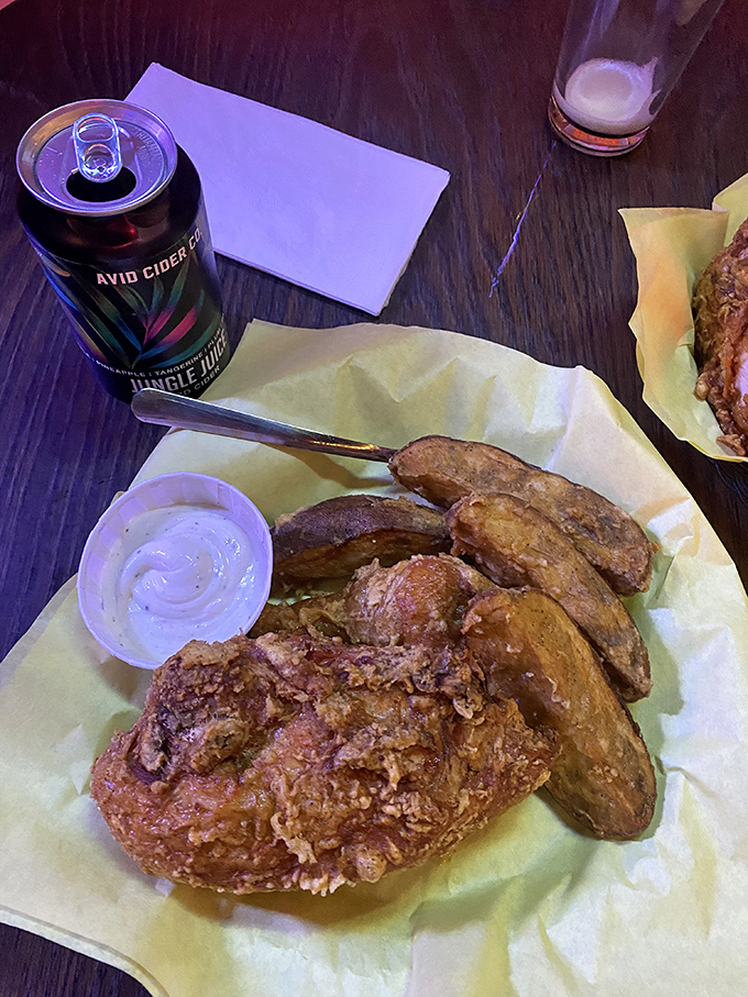 A cold beer's best friend: chicken and potatoes fried to such perfection that fancy white tablecloths would only get in the way.