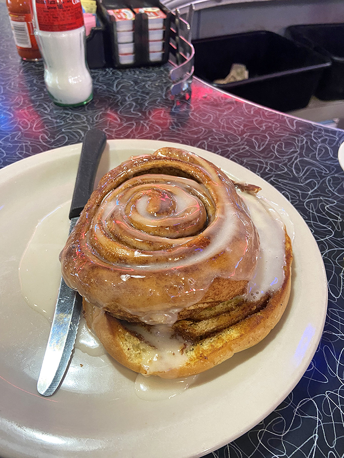 This cinnamon roll isn't just breakfast&mdash;it's a spiral-bound love story of dough, cinnamon, and glaze that makes Monday mornings bearable again.