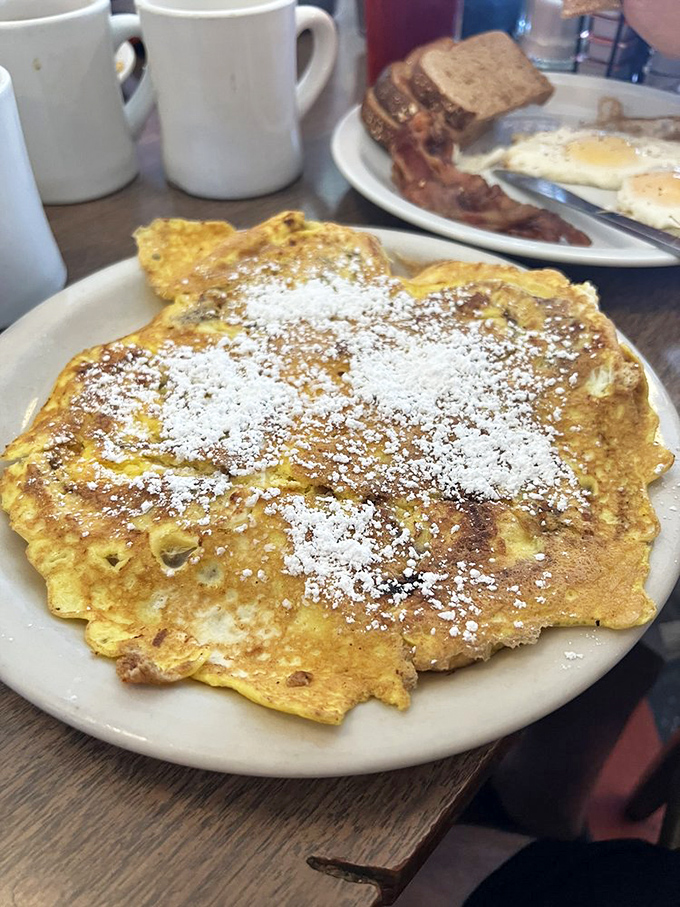 French toast that looks like it's wearing cinnamon roll pajamas. This isn't breakfast; it's what breakfast dreams about at night.