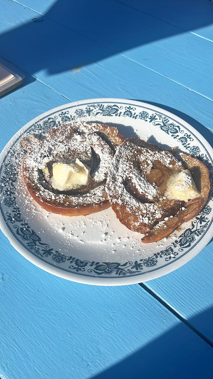 Simple pleasures done perfectly&mdash;golden toast meeting crispy bacon with orange juice standing by. Proof that breakfast excellence doesn't always require fancy footwork.