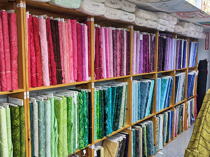 A gradient of fabrics arranged with such precision that color theorists would shed a tear. It's like a textile rainbow after a creative storm.