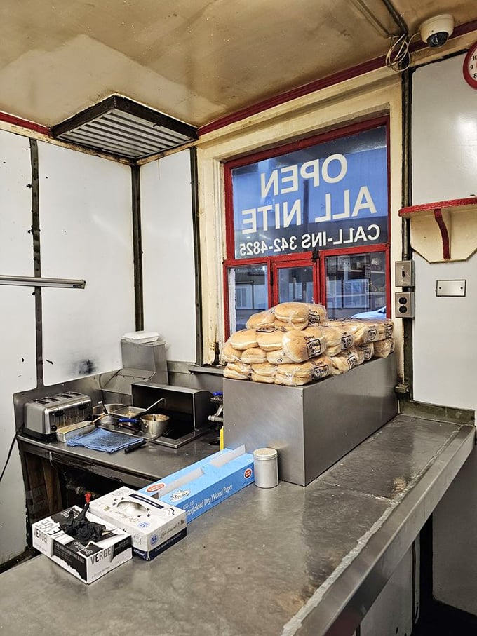 The kitchen area is a masterclass in efficiency. Like watching a submarine crew navigate tight quarters with the precision of ballet dancers.