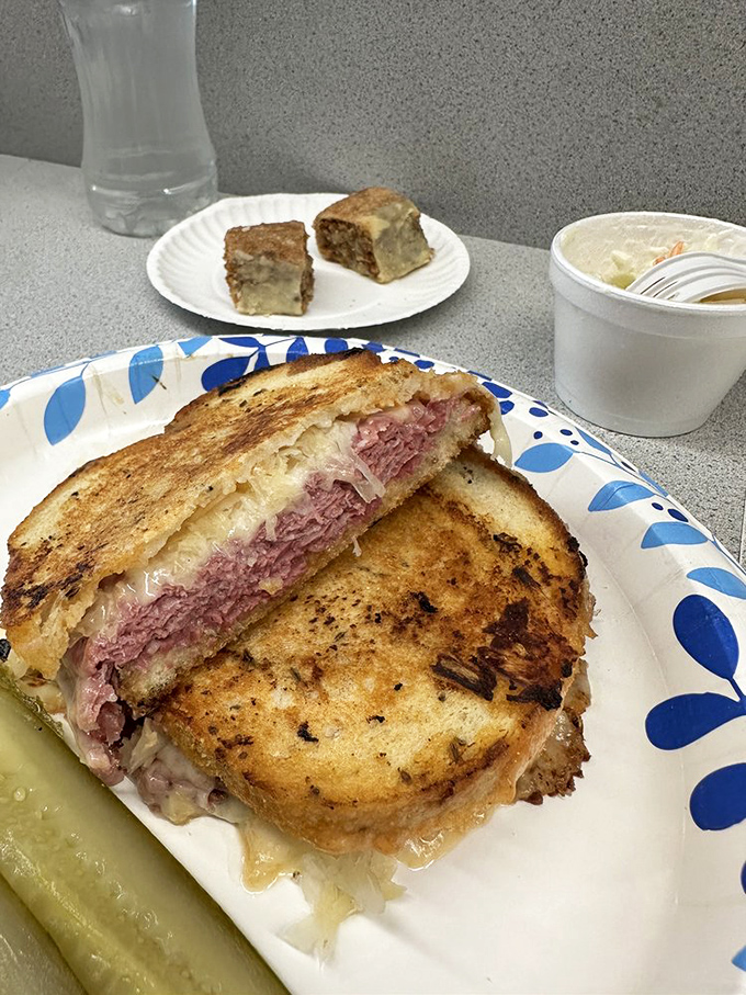 The Reuben in its natural habitat&mdash;golden-grilled rye revealing a treasure of corned beef and sauerkraut that makes you understand why people write songs about food.