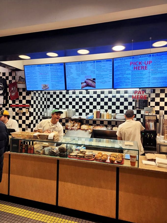 The classic black and white checkerboard floor isn't just decoration&mdash;it's a promise that this place takes its deli credentials seriously.