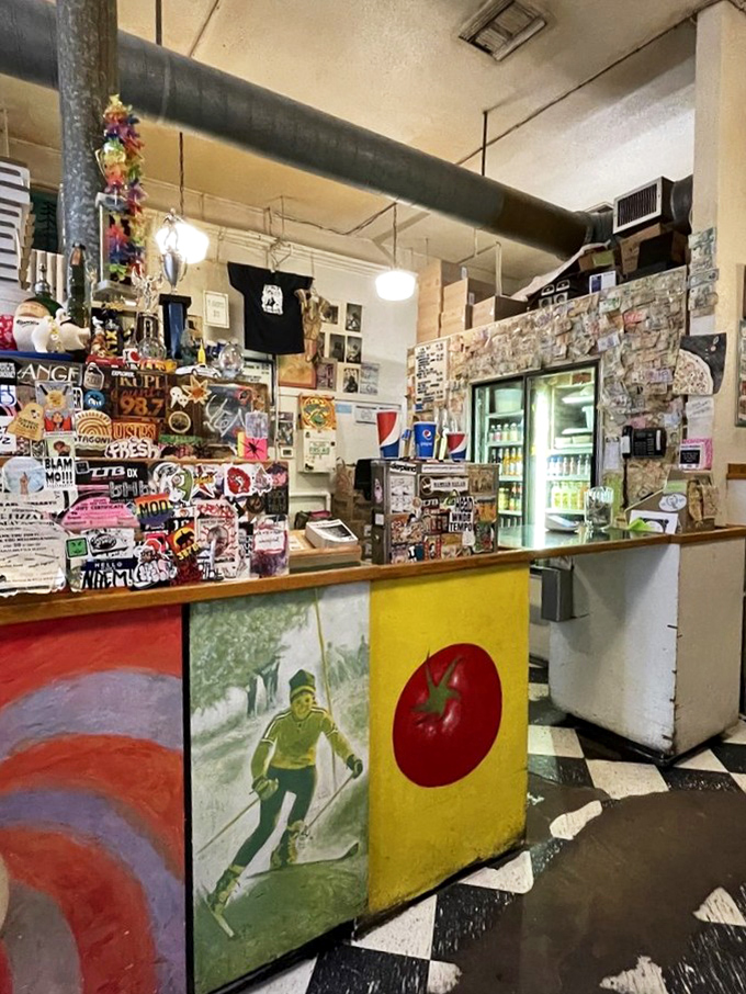 The counter view reveals the pizza joint's soul: decades of photos, memorabilia, and the kind of character money can't manufacture. 