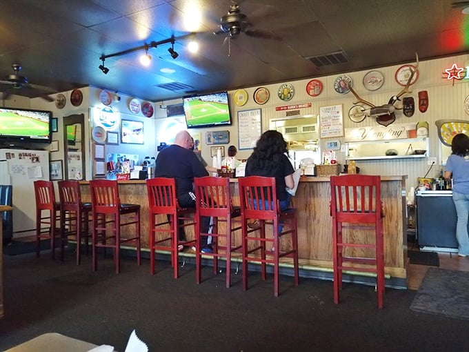 The counter seats&mdash;where regulars become family and first-timers become regulars. Those red chairs have heard more Arkansas stories than most history books.