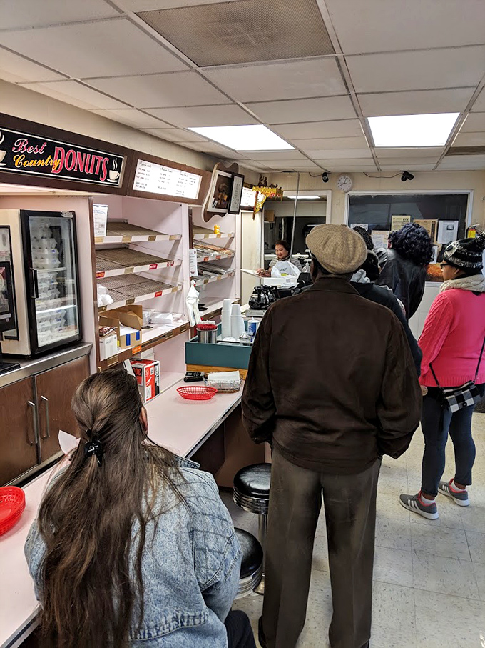 The morning queue&mdash;a testament to devotion. These customers know that good things come to those who wait (in donut lines).