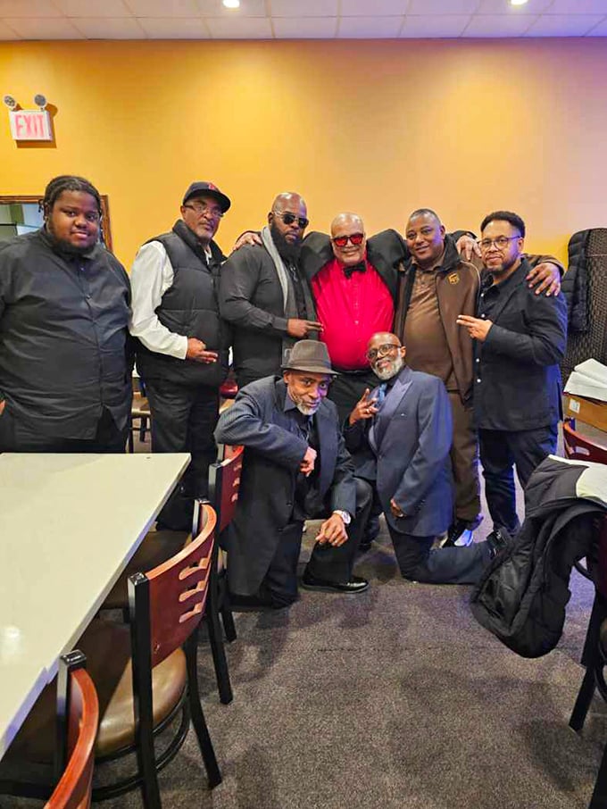 A gathering of dapper gentlemen enjoying their feast proves that Flaming Grill isn't just a restaurant—it's a community meeting place.