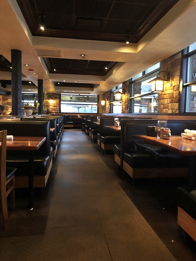 Leather booths and stone walls create the perfect backdrop for your dining adventure. It's like eating in a mountain lodge that got a degree in sophistication.